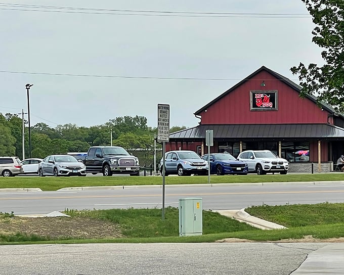 The classic red barn of LD's BBQ stands proud against the Wisconsin sky &ndash; a beacon for hungry travelers.