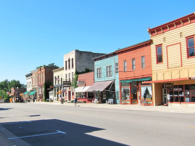 Rainbow-colored storefronts create a cheerful symphony that would make even grumpy neighbors crack a smile.
