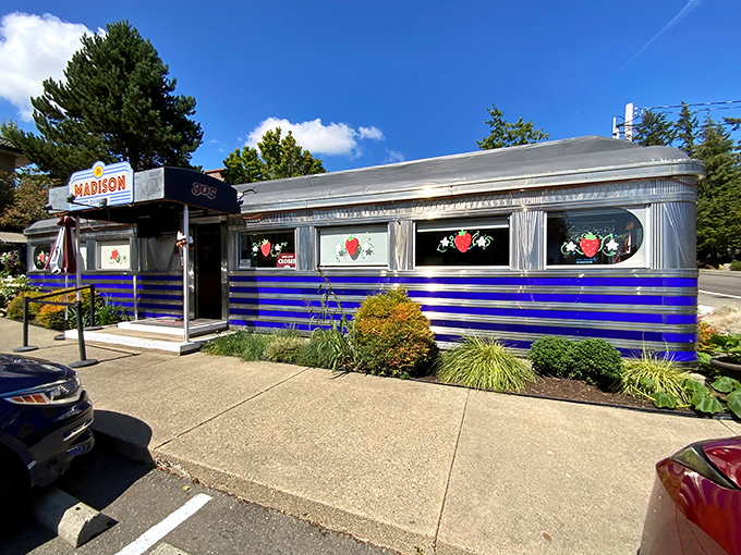 Classic Americana gleams in this vintage diner's polished chrome and bold blue stripes &ndash; a time capsule serving breakfast.