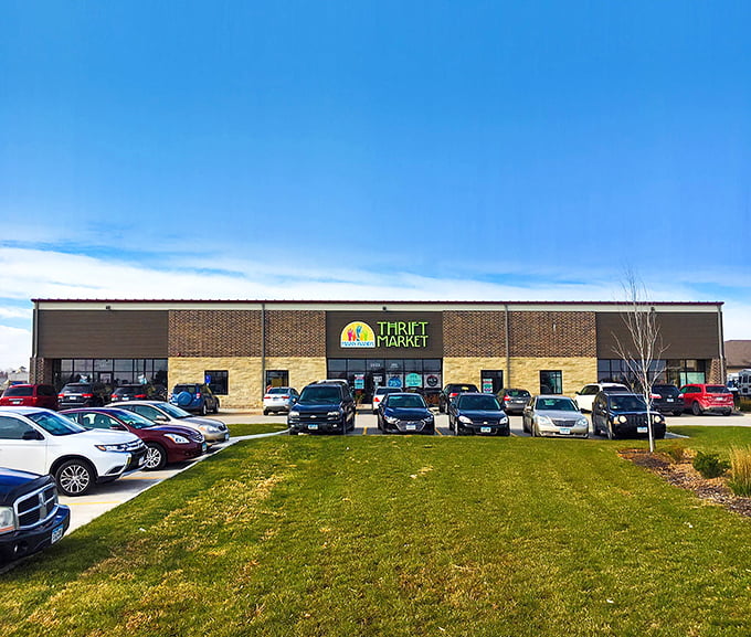 Many Hands Thrift Market stands proud against Iowa's blue sky. Your wallet and conscience can both leave happy here.