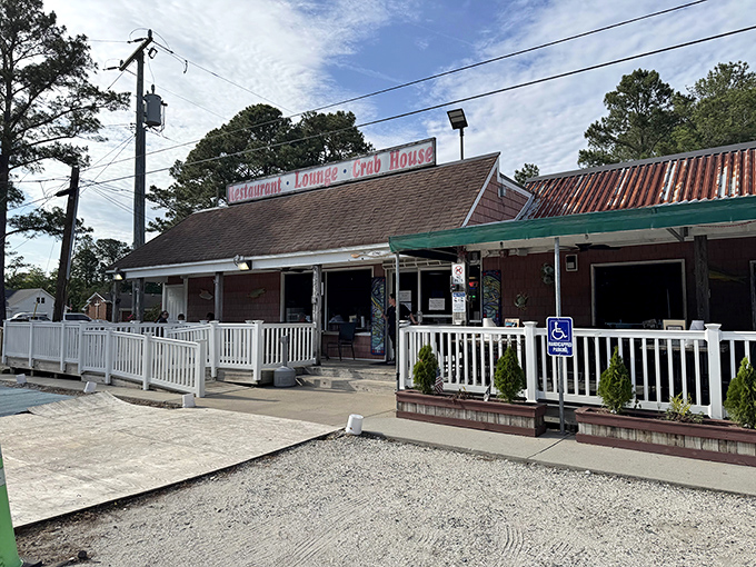 Margie & Ray's weathered sign and white fence welcome you like an old friend who happens to make killer crab dishes.