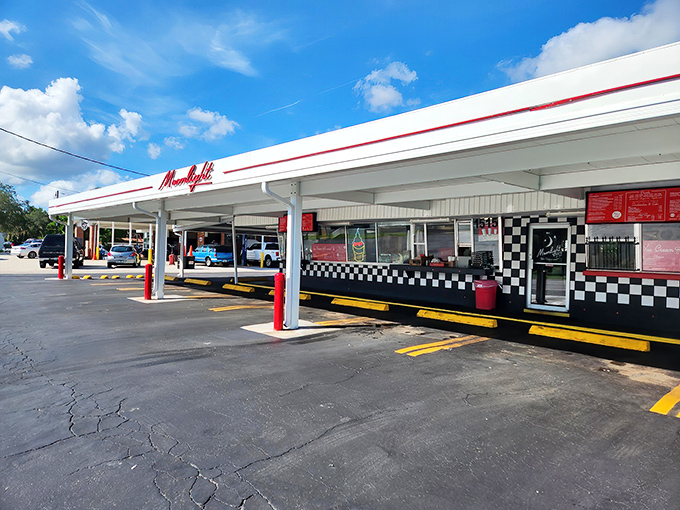 Moonlight Drive-In's classic black and white checkered facade promises a taste of yesteryear. Some places just get better with age!