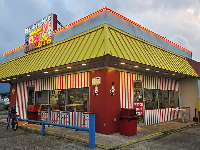 Mr. Ronnie's candy-striped wonderland looks like Willy Wonka opened a donut shop. That yellow roof practically shouts "happiness served daily!"