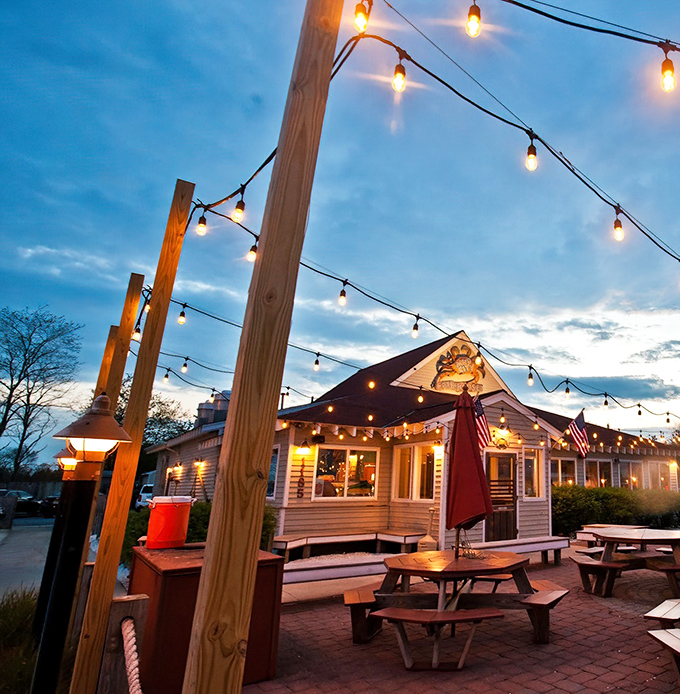 String lights and summer nights! Mud City's wooden charm creates the perfect backdrop for cracking shells while ocean breezes carry the scent of Old Bay seasoning.