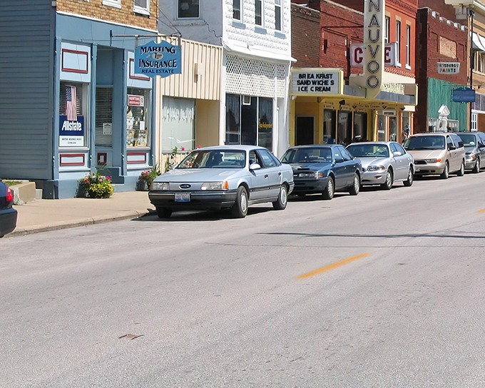 Nauvoo's charming main street showcases simple storefronts that have witnessed generations of local commerce and community gatherings.