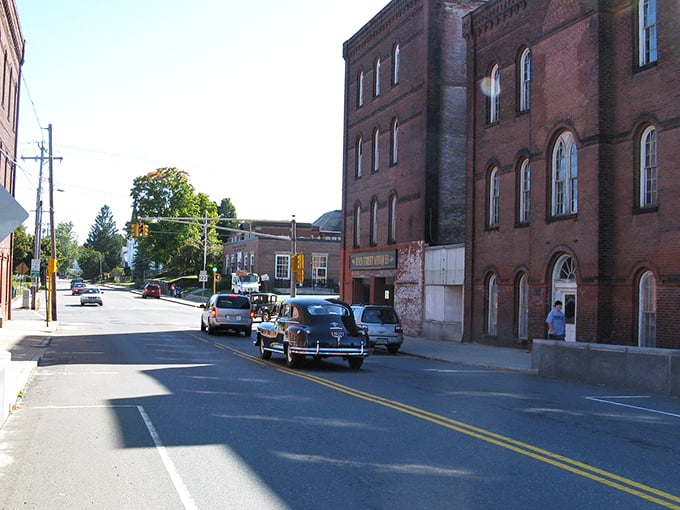 Orange you glad you found this gem? Classic cars cruise past historic brick beauties where rent checks don't cause heart palpitations.