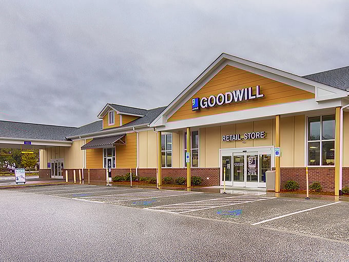 Goodwill's cheerful yellow facade promises sunshine inside. Like a department store where every purchase tells a story.