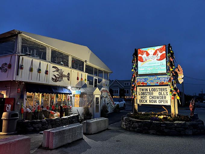 Petey's at twilight &ndash; where colorful buoys and twinkling lights transform a simple building into seafood magic after dark.