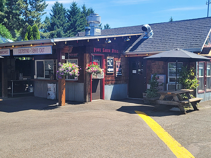 Pine Shed's rustic wooden exterior promises authentic BBQ magic. Those hanging flower baskets can't mask the intoxicating aroma of slow-smoked goodness.