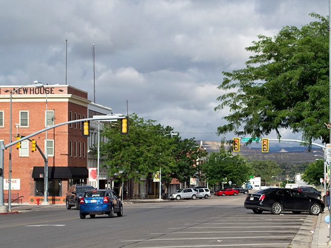 Price's brick buildings stand proudly against desert hills, proving small towns have big character.