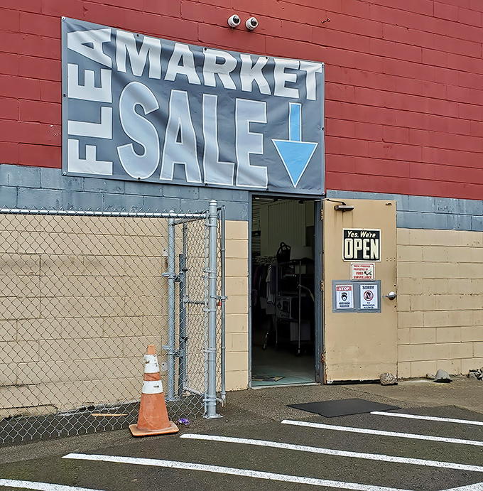 The entrance to Puyallup Flea Market beckons with its bold "FLEA MARKET SALE" sign – treasure hunting starts here!