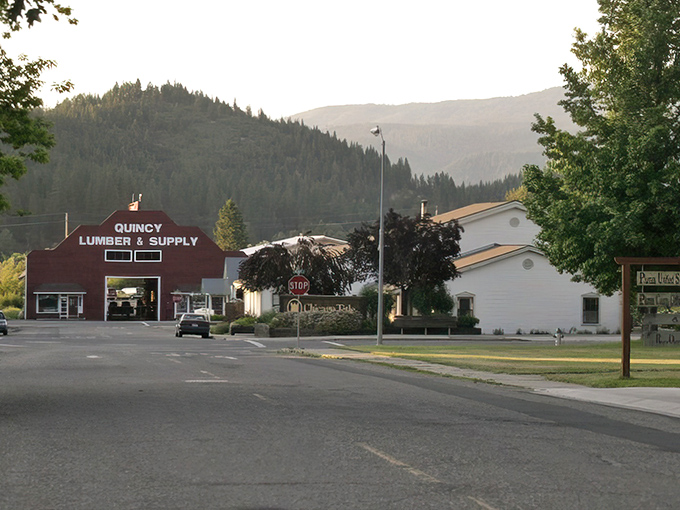 Quincy Lumber & Supply stands as a testament to mountain town tradition, framed by Sierra Nevada's majestic backdrop.