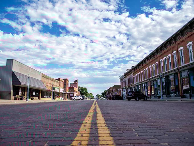Red brick buildings create a warm embrace along this perfectly preserved slice of prairie history.
