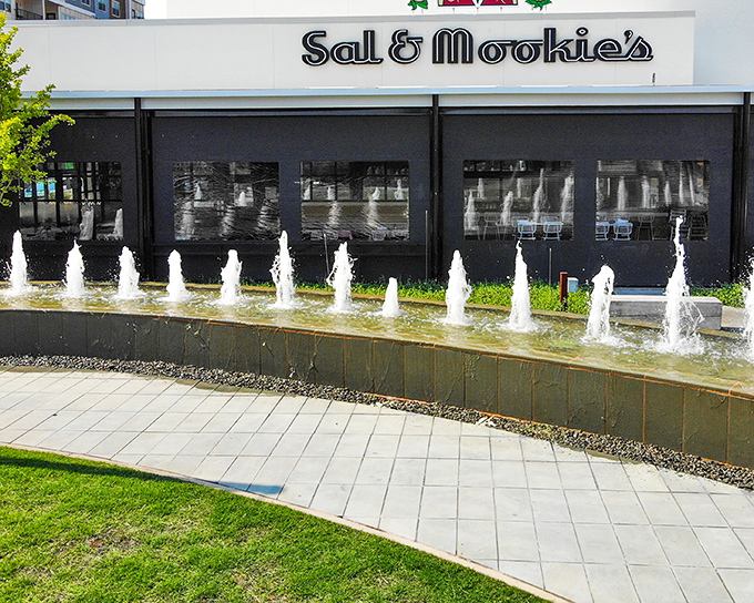 Modern fountains dance outside Sal & Mookie's, where contemporary design meets timeless pizza perfection.