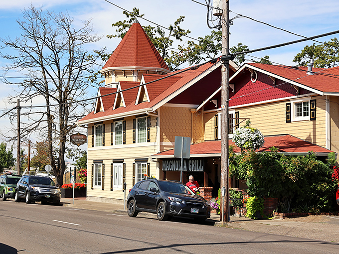 The Magnolia Grill in Silverton stands like a Victorian time capsule, complete with that red-roofed turret that screams "come in for pie!"