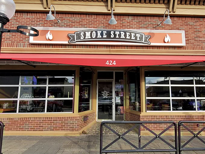 Smoke Street's brick-front charm and classic signage &ndash; where BBQ dreams come true in downtown Milford's most aromatic corner.