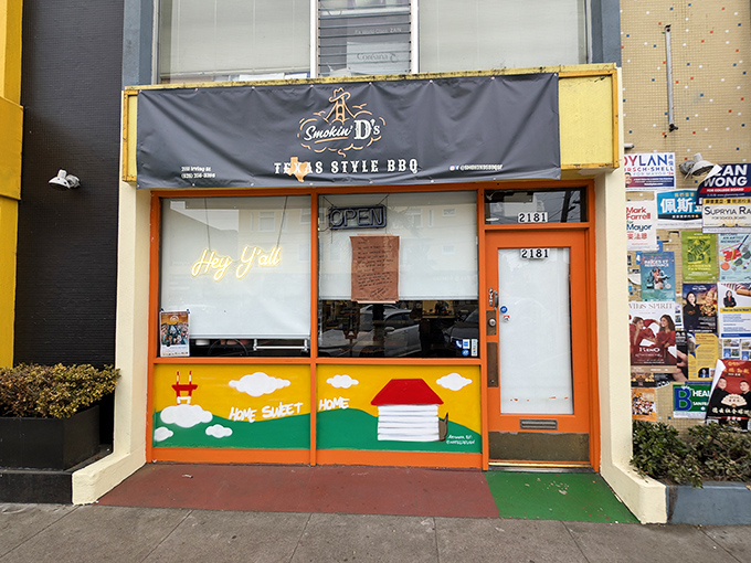 Smokin D's colorful storefront brings Texas heat to foggy San Francisco with its cheerful "Hey Y'all" welcome.