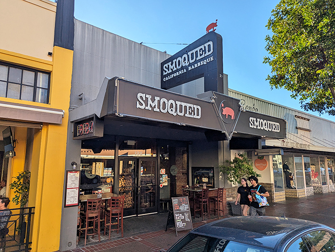 Smoqued's black awning and pig logo announce serious BBQ business in Old Towne Orange. The California Barbeque sign promises a West Coast spin on smoky traditions.