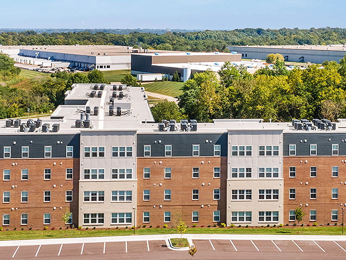 These well-maintained buildings stretch across the landscape like a promise that retirement savings can actually last.