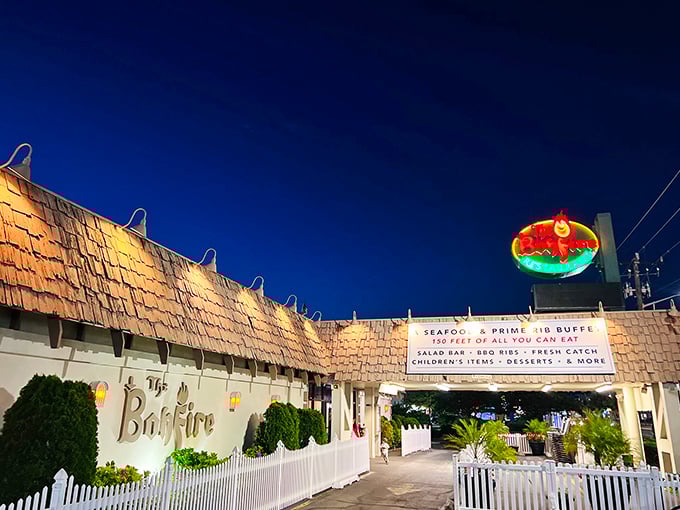 That neon sign glowing against the evening sky promises seafood adventures that'll make your taste buds sing.