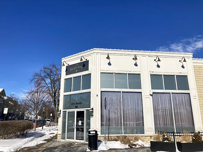The Burger Local's clean white exterior stands like a beacon for hungry travelers. Inside those walls, burger magic happens daily!