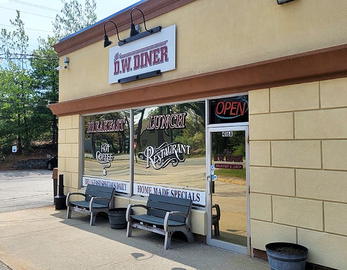 The D.W. Diner's humble exterior hides breakfast magic within. Those benches outside? They're for the folks who couldn't resist coming back.