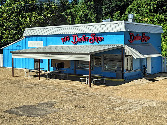This bright blue beacon stands ready to fuel your adventures with fresh donuts and small-town charm.