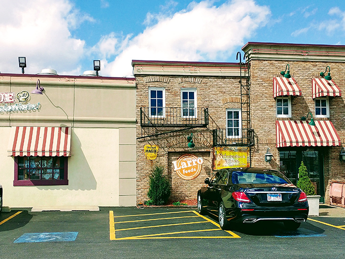 The Pit Rib House's charming striped awnings and brick facade are like a barbecue welcome mat saying, "Come on in, your diet can start tomorrow."