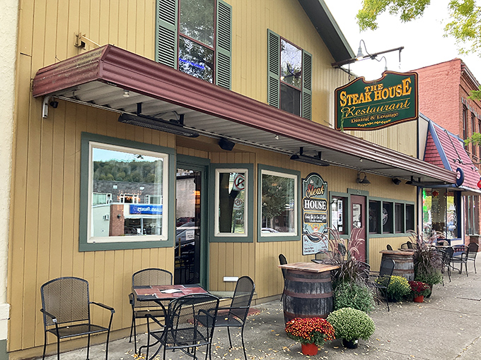 The Steak House's charming yellow exterior is like a beacon for beef lovers wandering through Wellsboro's historic streets.