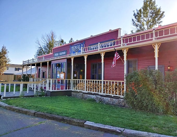 Tumalo Feed Company's classic red facade promises the kind of steakhouse experience that never goes out of style.
