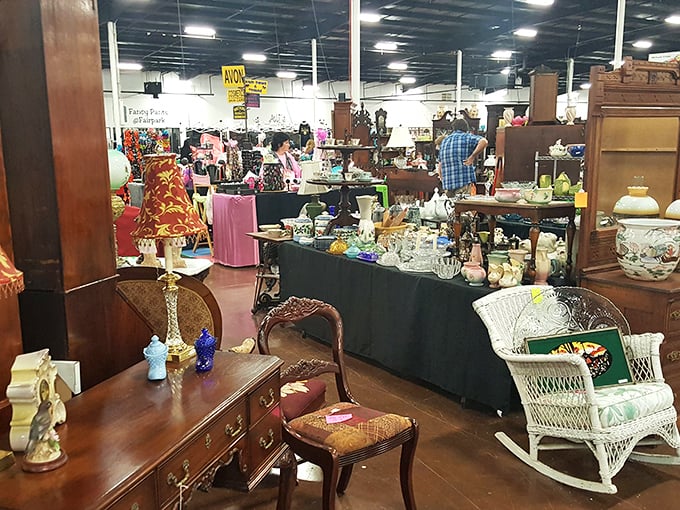 Inside Tupelo Flea Market, antique furniture creates cozy room displays that feel like grandma's attic treasures.