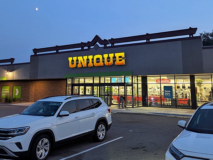 Unique by name, unique by treasures! This thrift emporium glows with possibility under the evening sky.