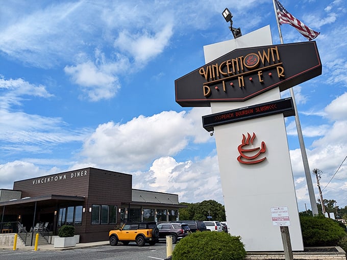 Don't let the sleek modern exterior fool you - this towering sign promises old-fashioned diner satisfaction.