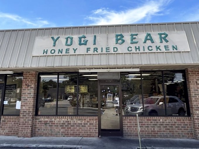That "Honey Fried Chicken" sign promises a sweet-savory combo that's worth traveling for. Simple exterior, extraordinary flavor inside.