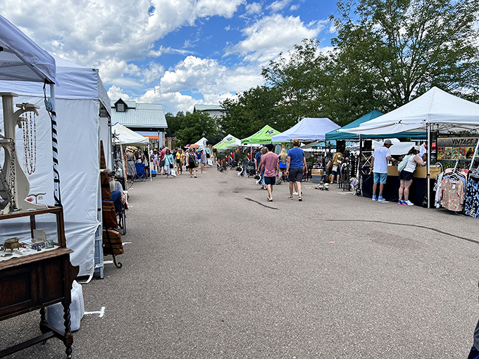 White tents create a European market vibe, perfect for leisurely weekend treasure hunting with the family.