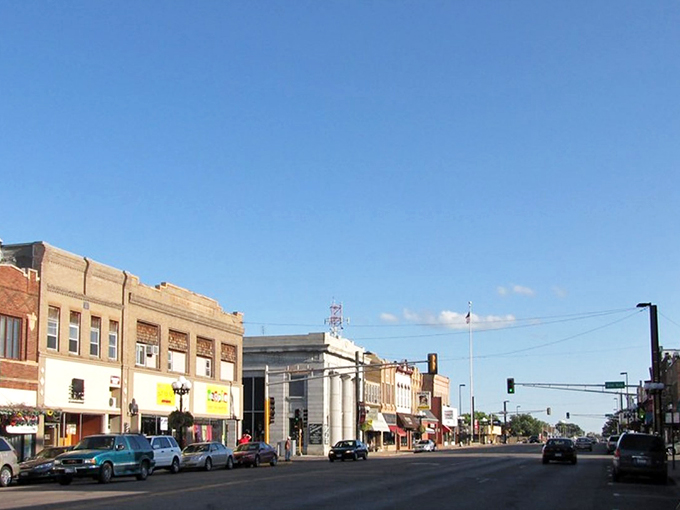 Downtown Alexandria captures small-town charm with classic storefronts, vintage signs, and a sunny, open sky.