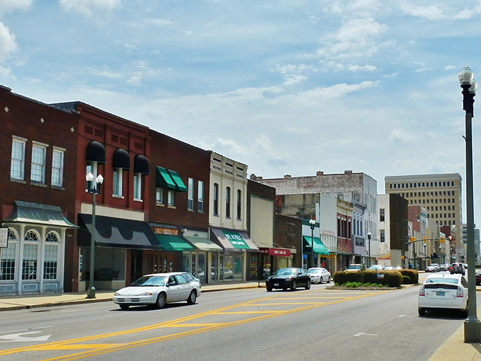 Blue skies and budget-friendly businesses&mdash;Anniston's historic theater marquee still advertises prices from a gentler era.