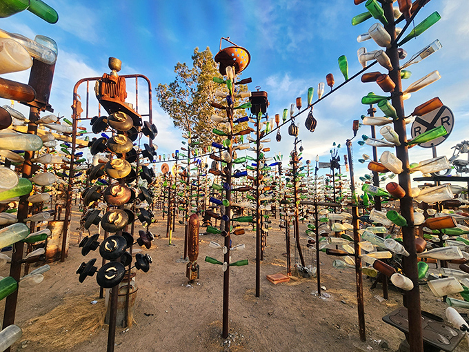 Thousands of glass bottles catch the sunlight, transforming trash into treasure in this roadside art installation.