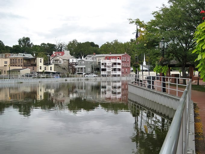 This waterfront walkway proves paradise doesn't always require palm trees - sometimes a peaceful pond does the trick.