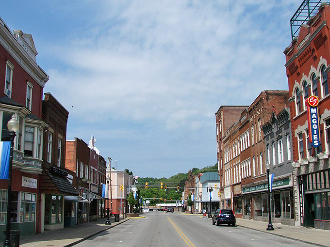 Downtown Buckhannon stretches toward the hills like a Norman Rockwell painting come to life, with Maggie's sign winking at passersby.