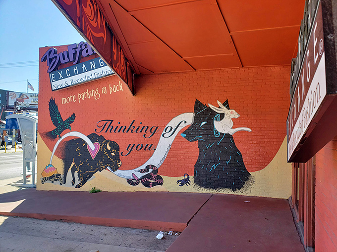 The burnt orange awning practically glows with creative energy, inviting fashion hunters to discover curated vintage gems and stylish scores.