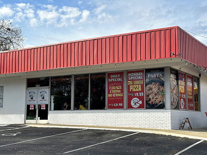 That classic pizza joint look! Behind those windows at Bussin Pizza, dough wizards are crafting the kind of pies that become weekly traditions.