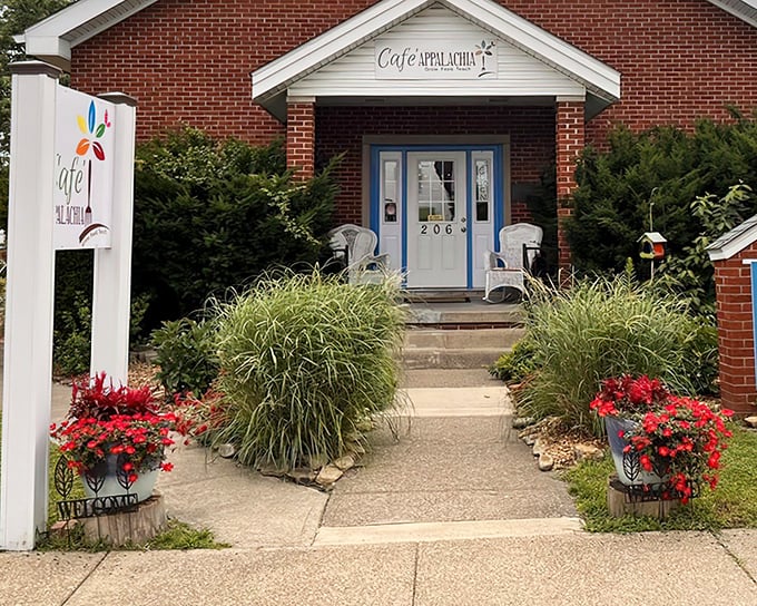 Garden-framed pathways lead to breakfast paradise. Cafe Appalachia's colorful flowers hint at the fresh, vibrant flavors waiting inside.