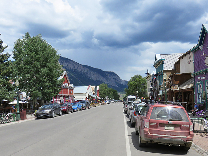 Downtown Crested Butte with its painted storefronts and mountain views &ndash; like walking into a Wes Anderson film set in the Rockies.
