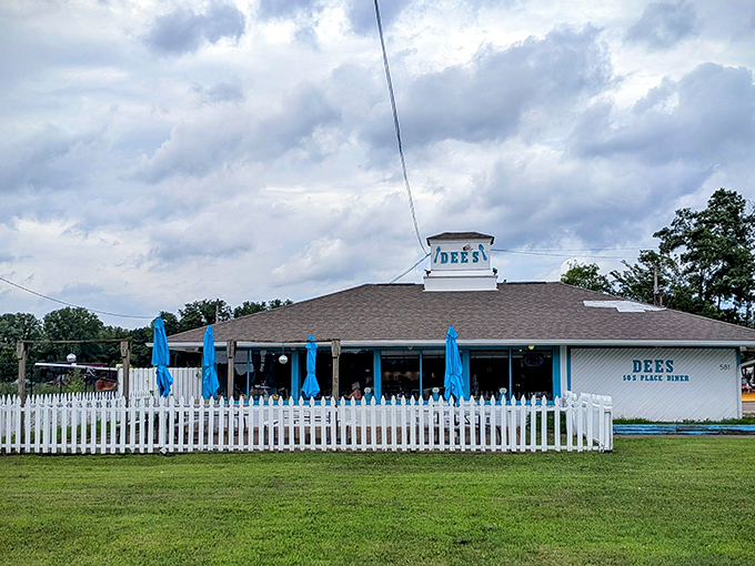 Blue umbrellas dot the patio at Dee's, where comfort food meets fresh air in perfect small-town harmony.