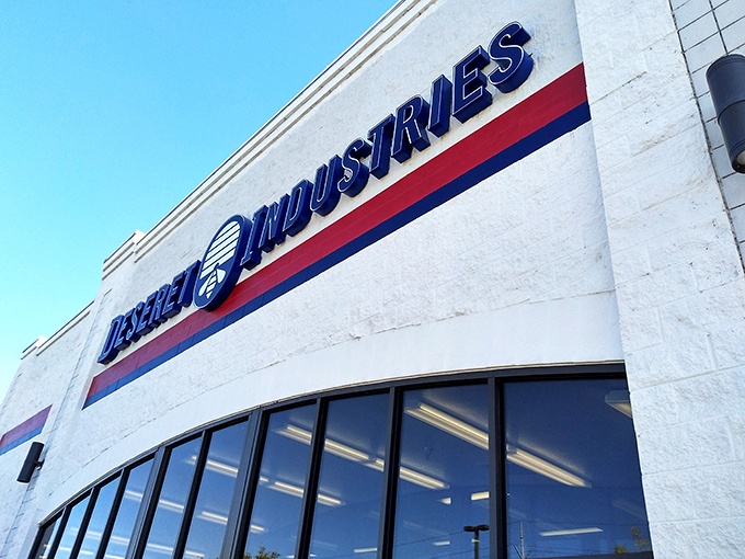 The bold blue Deseret Industries sign stands out like a beacon for budget-conscious shoppers on a mission.