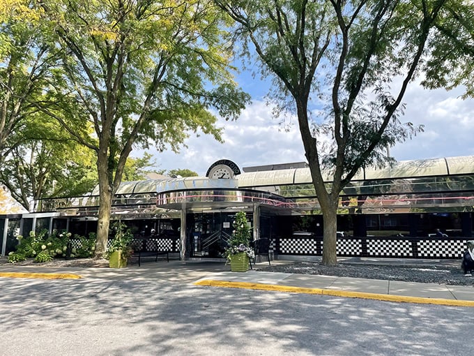 Sunlight dapples through trees onto Drake Diner's classic curved roof. This Des Moines institution serves breakfast worth setting your alarm for.