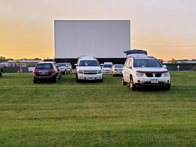 Golden hour at the movies! As day surrenders to dusk, these lucky viewers settle in for Hollywood magic served with a side of spectacular sunset.