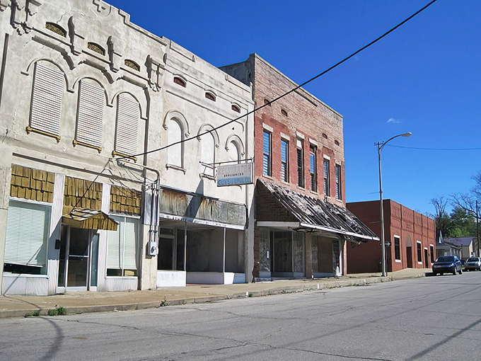 Classic brick buildings line the streets like old friends, each one weathered but still standing proud.