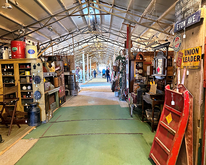 Metal roofs and concrete floors house endless rows of antiques waiting for new homes.